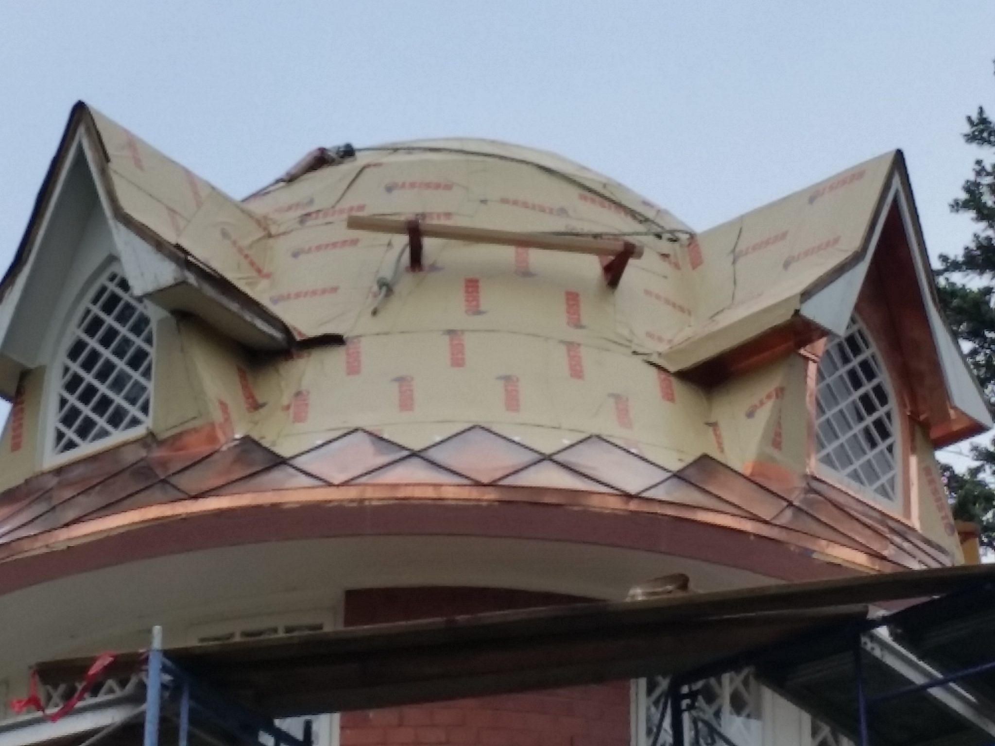 Copper shingles on turret with dormer - Spengler Industries